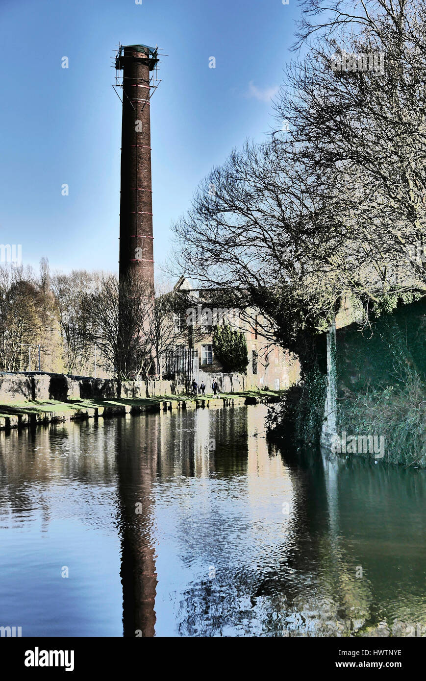 19th century mill chimney on the side of the Leeds Liverpool canal ...
