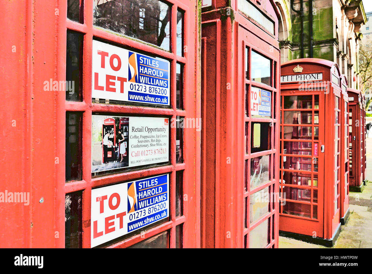 Row of red telephone boxes in Preston city centre available for let ...