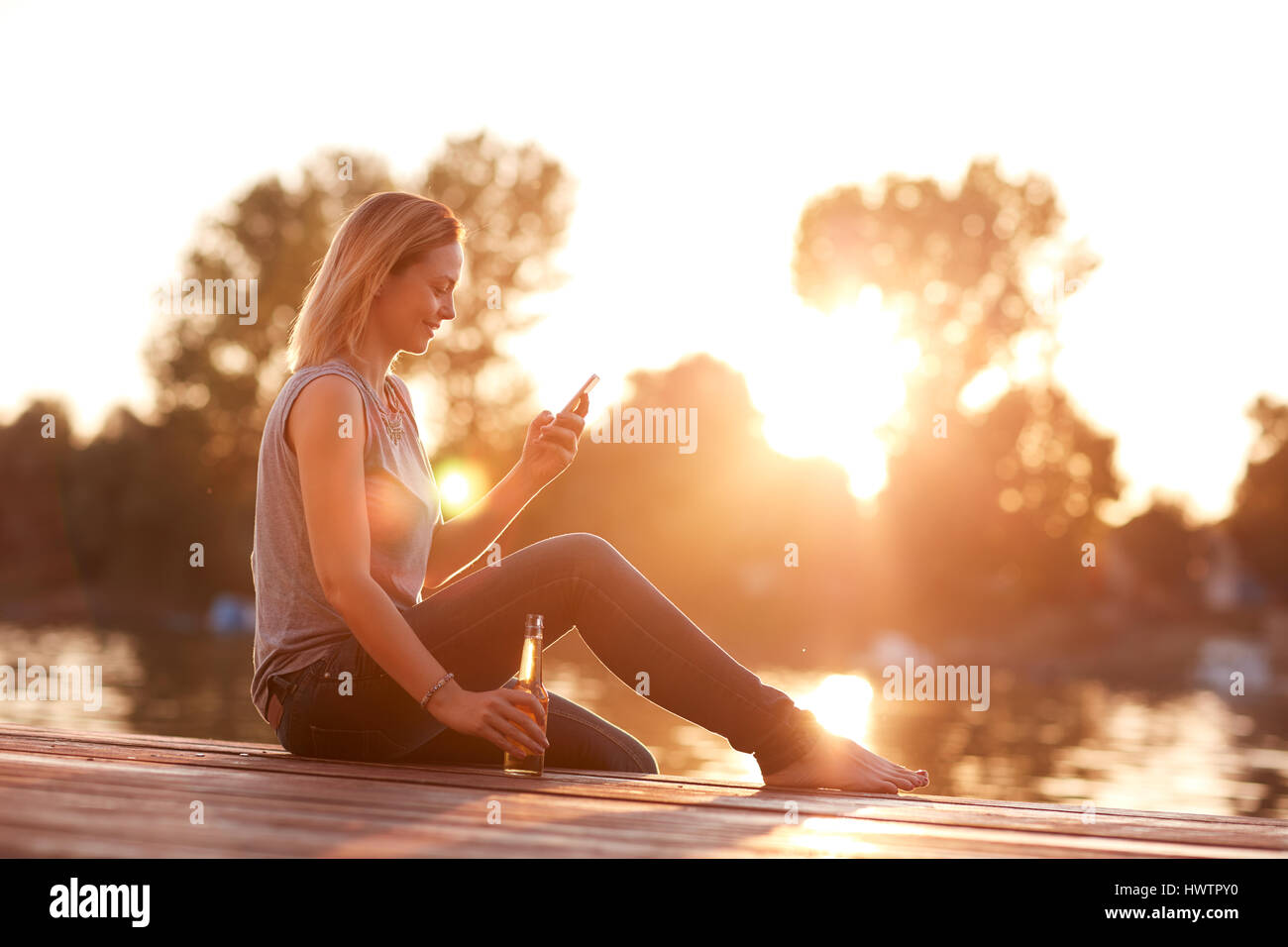 A Girl Sitting Alone In The Sunrise