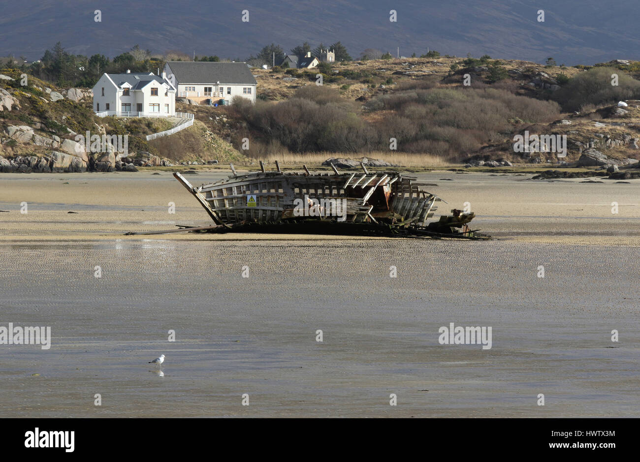 The wreck of a wooden fishing boat at Bunbeg, County Donegal, Ireland ...