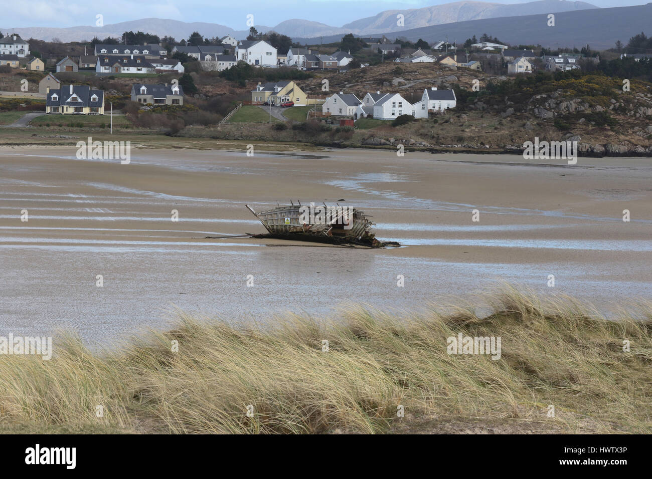 The wreck of a wooden fishing boat at Bunbeg, County Donegal, Ireland ...