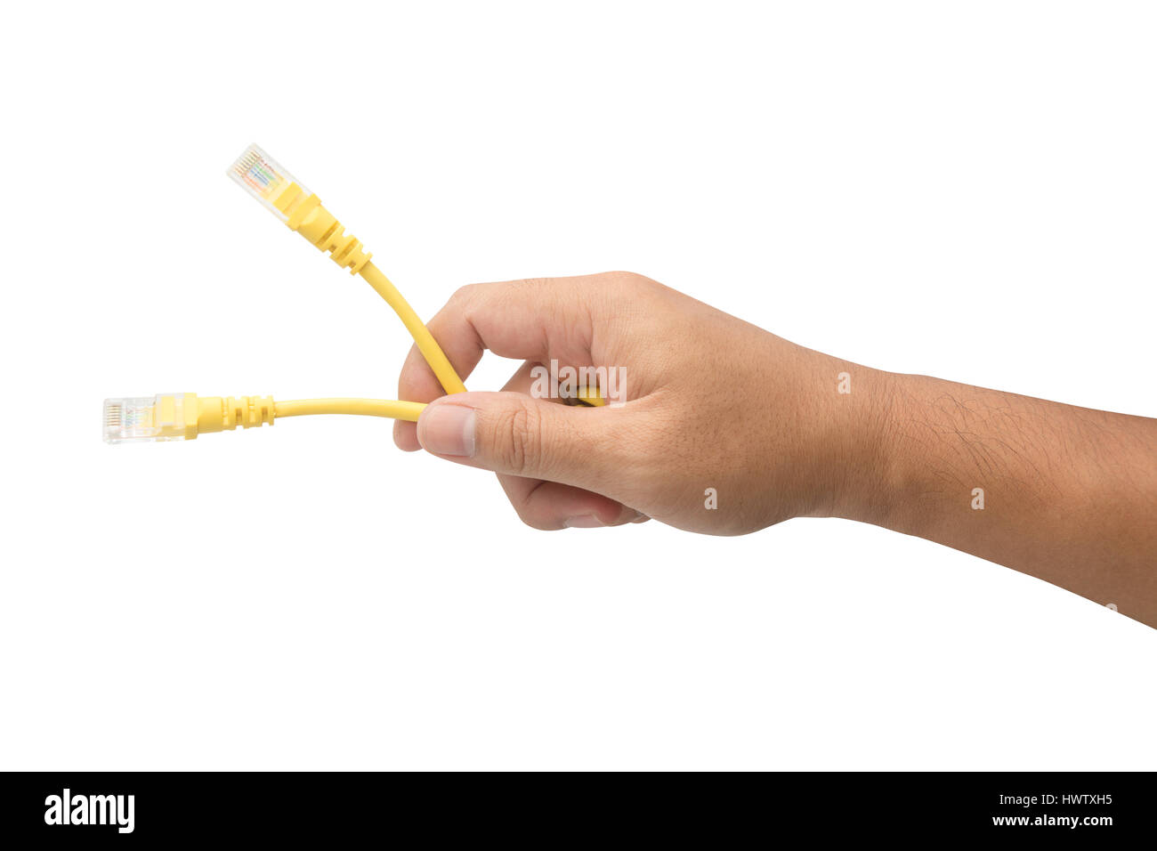 Male hand holding yellow lan cable isolated on white background with ...