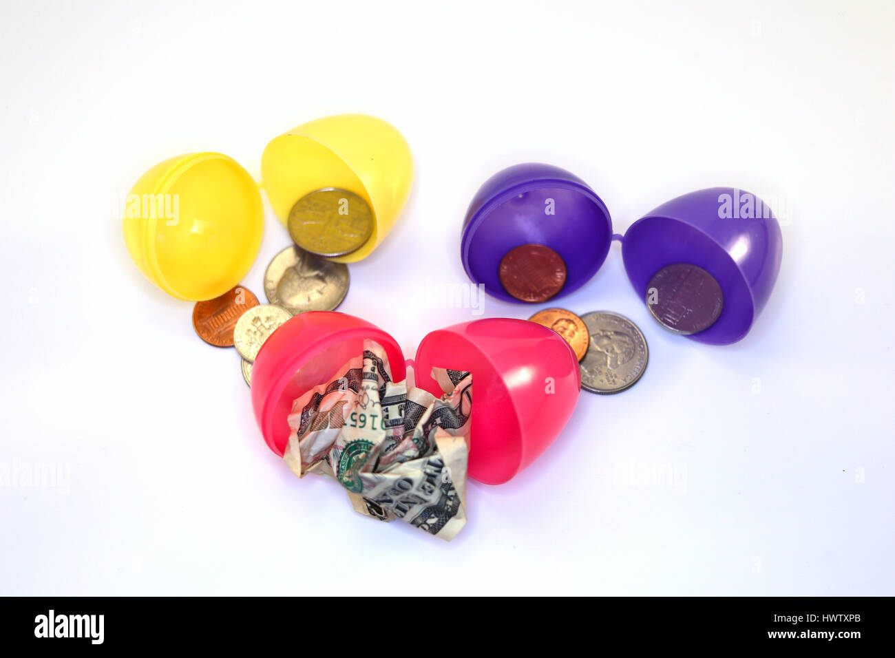 Assorted easter eggs with money inside Stock Photo - Alamy