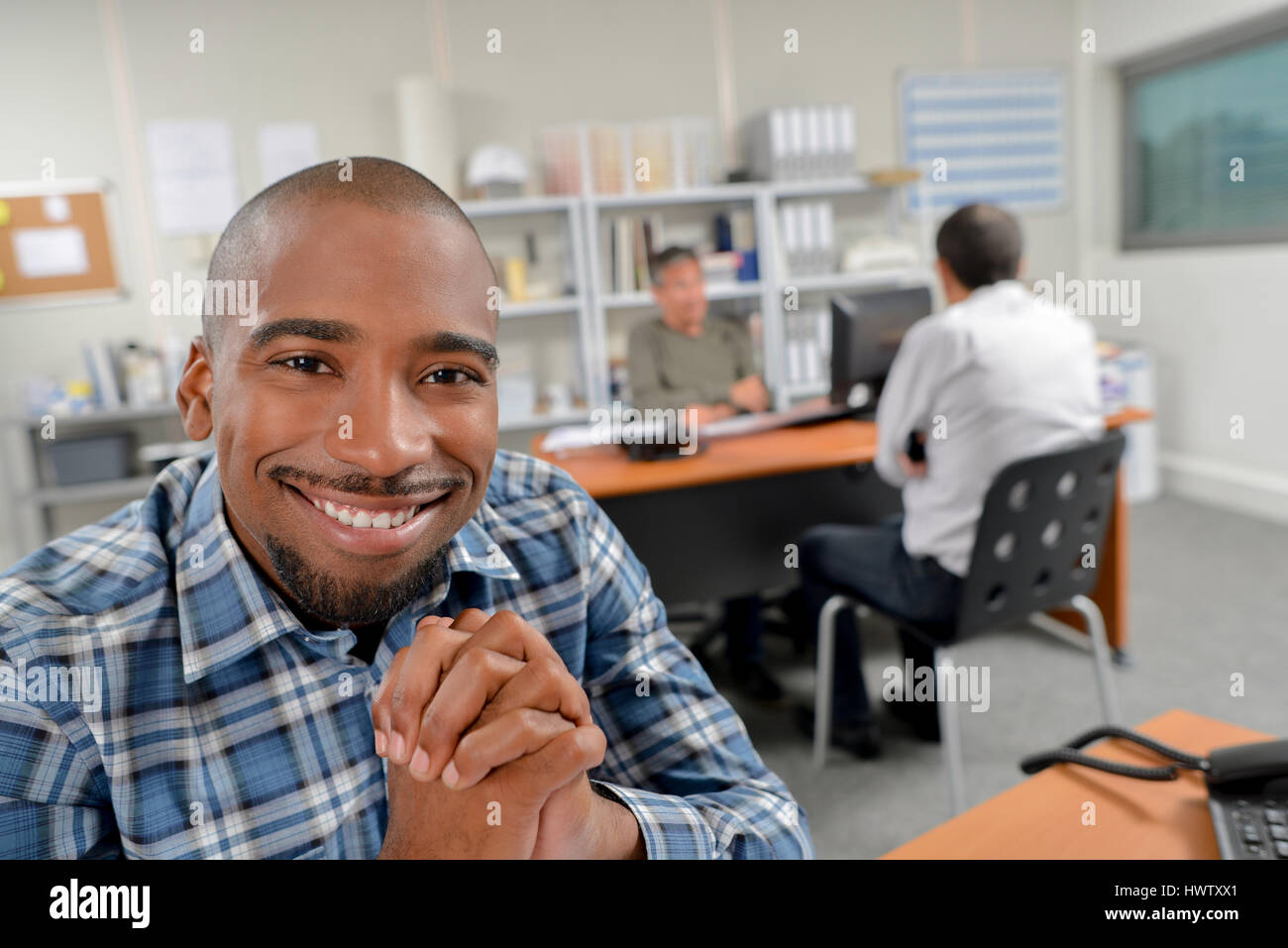 Happy office worker Stock Photo - Alamy