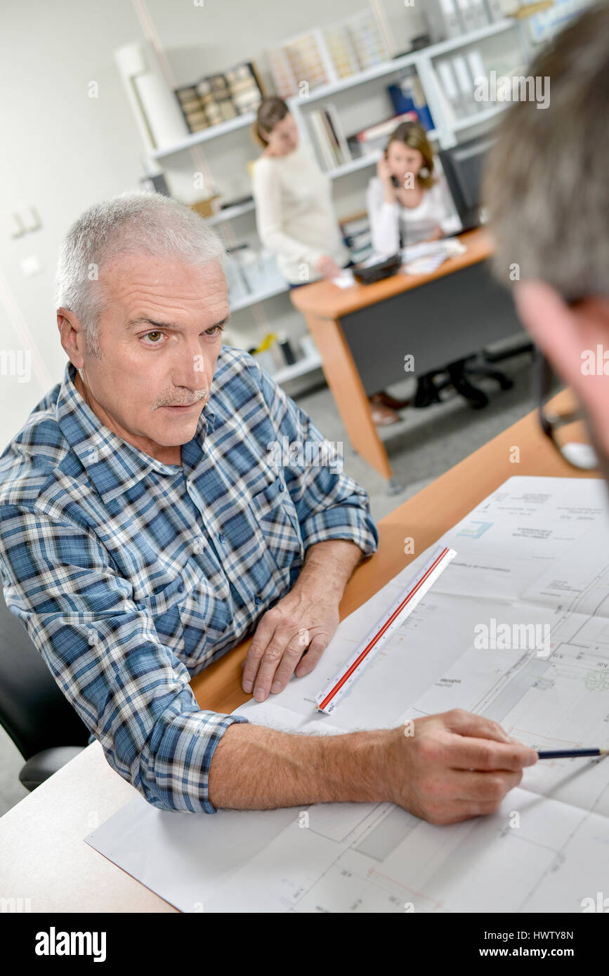 Architect trying to convince client Stock Photo - Alamy