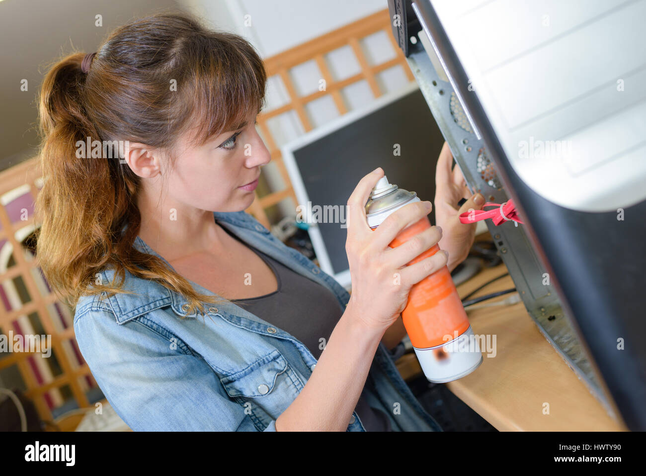 spraying the computer Stock Photo - Alamy