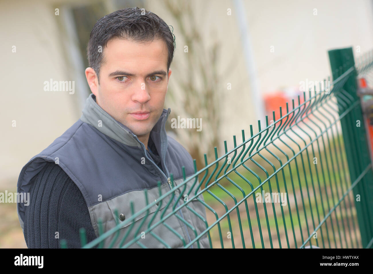 man at a fence Stock Photo - Alamy