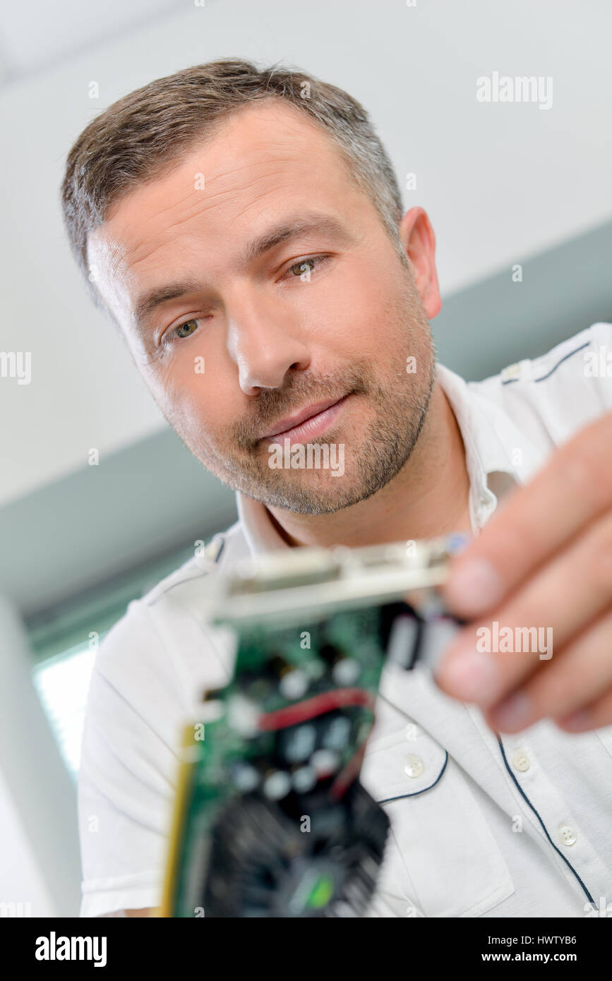 Installing a video card Stock Photo - Alamy