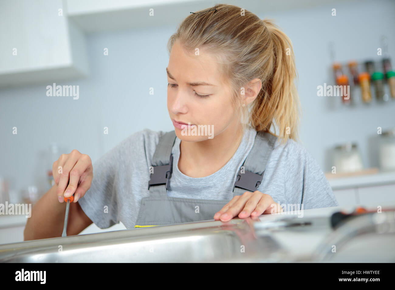 Woman using screwdriver hi-res stock photography and images - Alamy