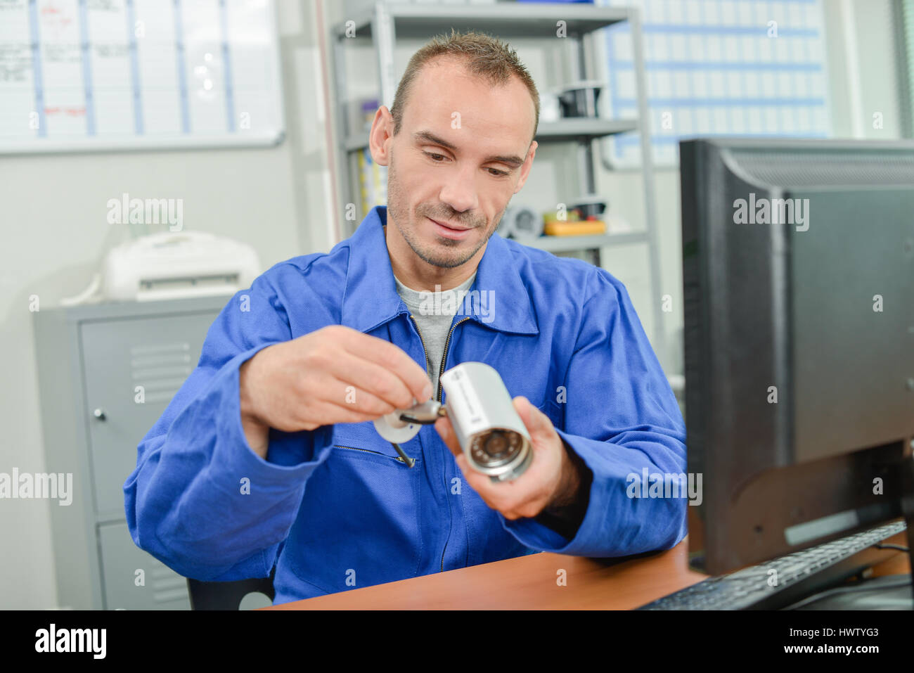 Checking a security camera Stock Photo - Alamy