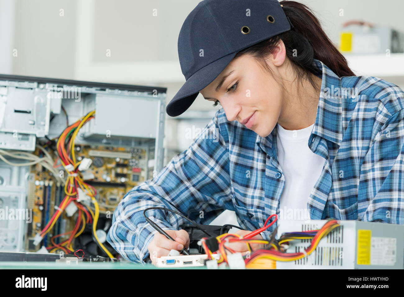 Female computer engineer repairing computer hi-res stock photography ...