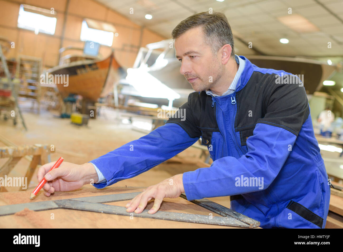 fixing a boat Stock Photo - Alamy