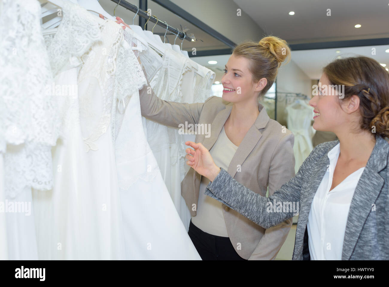 Wedding dress shop assistant hi-res stock photography and images - Alamy