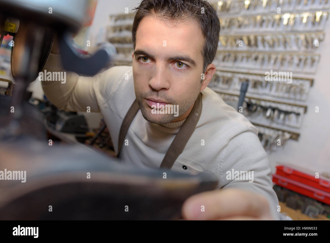 Cobbler at work Stock Photo - Alamy