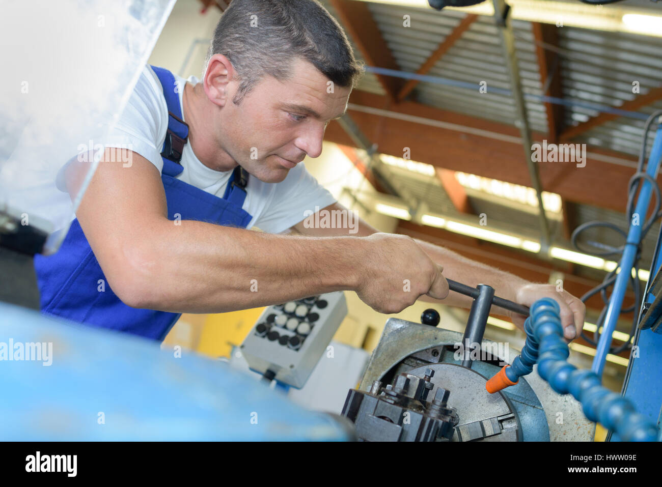 machinist fixing a machine Stock Photo - Alamy