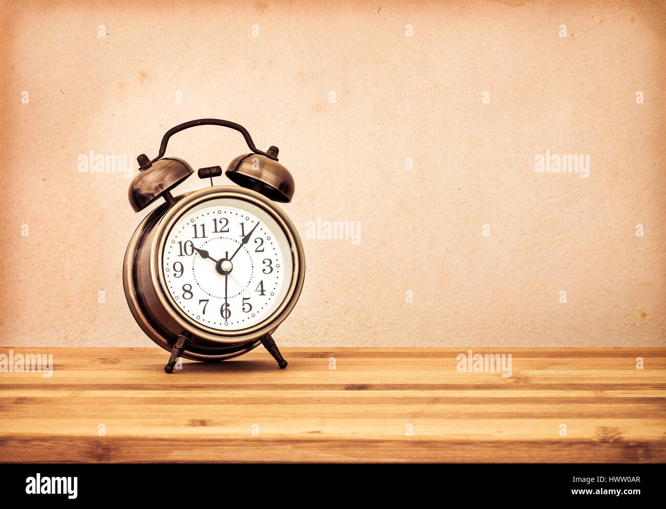 the retro and vintage style of Old fashioned the alarm clock on wooden ...