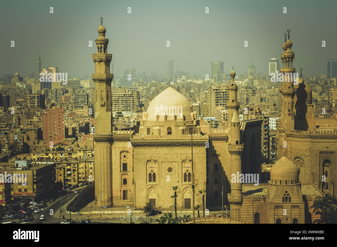 old mosque with high buildings Stock Photo - Alamy