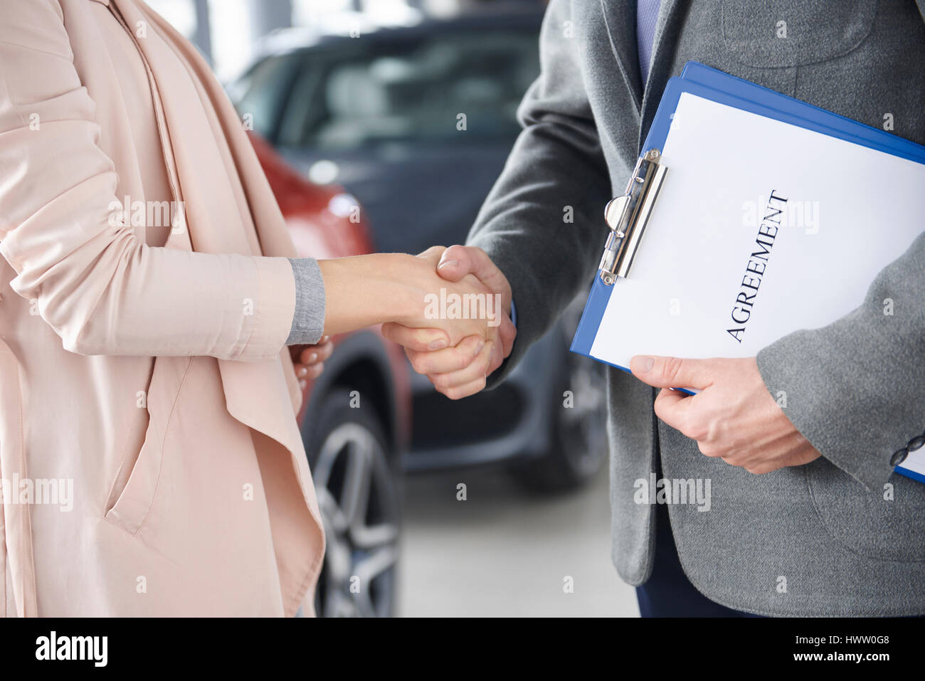 Close up of handshake customer and salesman Stock Photo - Alamy