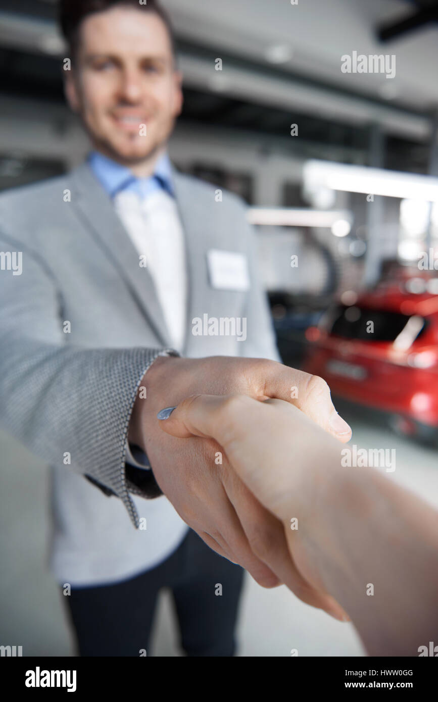 Close up of handshake in the showroom Stock Photo - Alamy