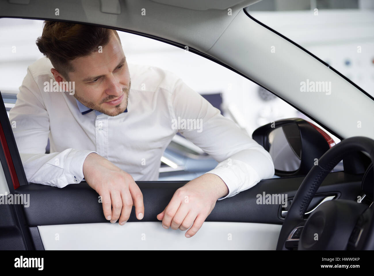 Pensive man looking at dashboard Stock Photo - Alamy