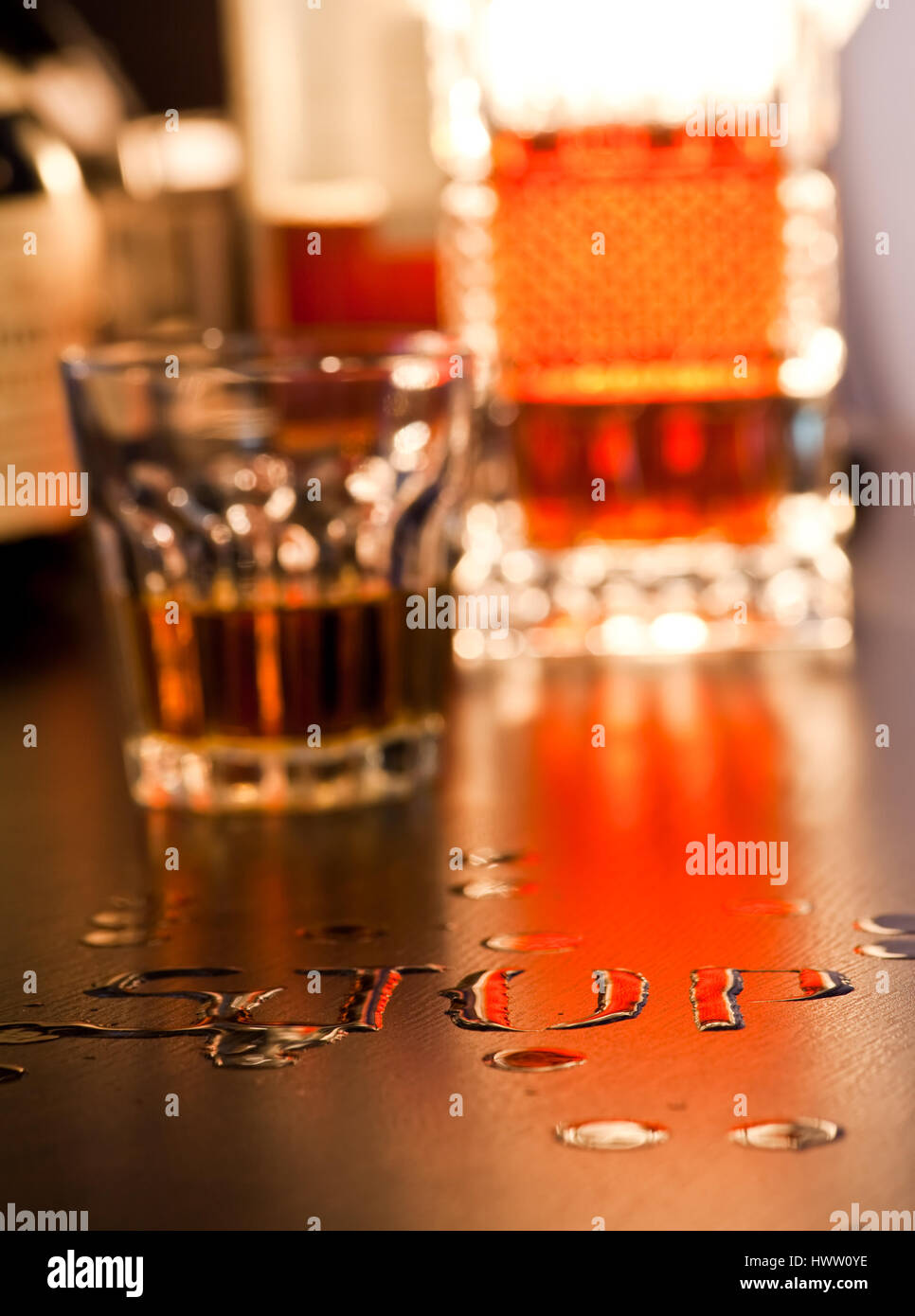 The Word Stop Written With Spoiled Whiskey On A Table Shallow DOF