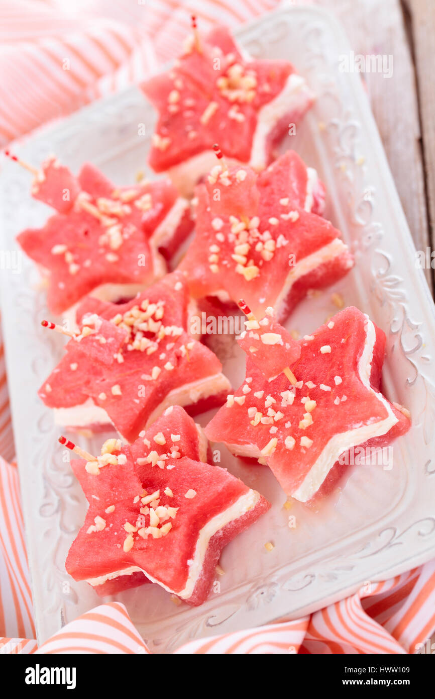 Star shaped watermelon sandwiches with soft cheese and nuts Stock Photo ...