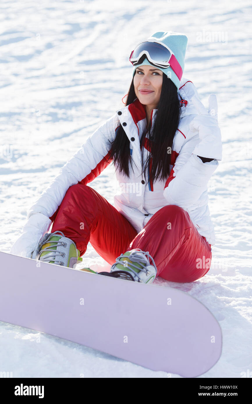 Girl with snowboard on winter Stock Photo - Alamy
