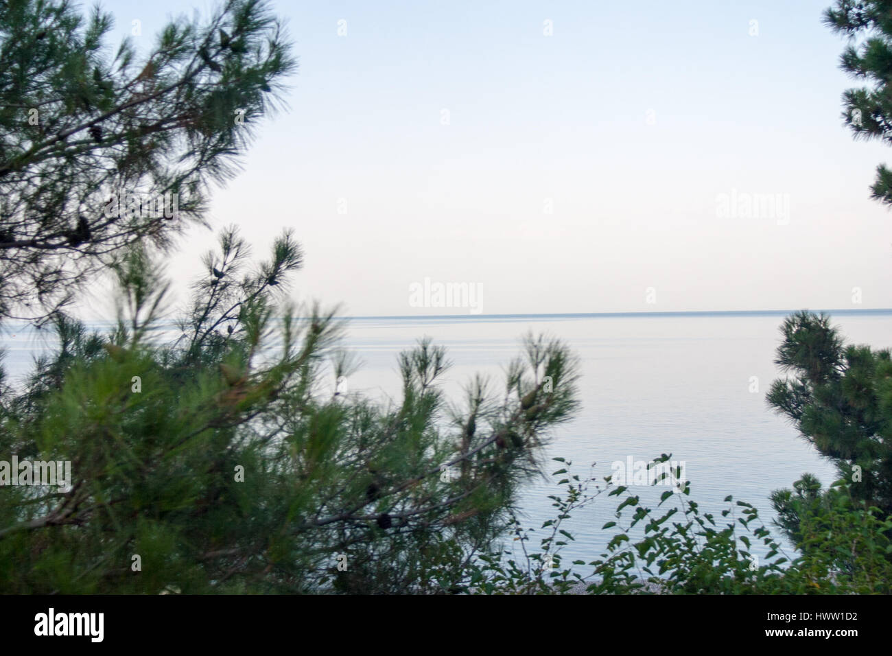 A view of the flat sea surface up to the horizon through a window in ...