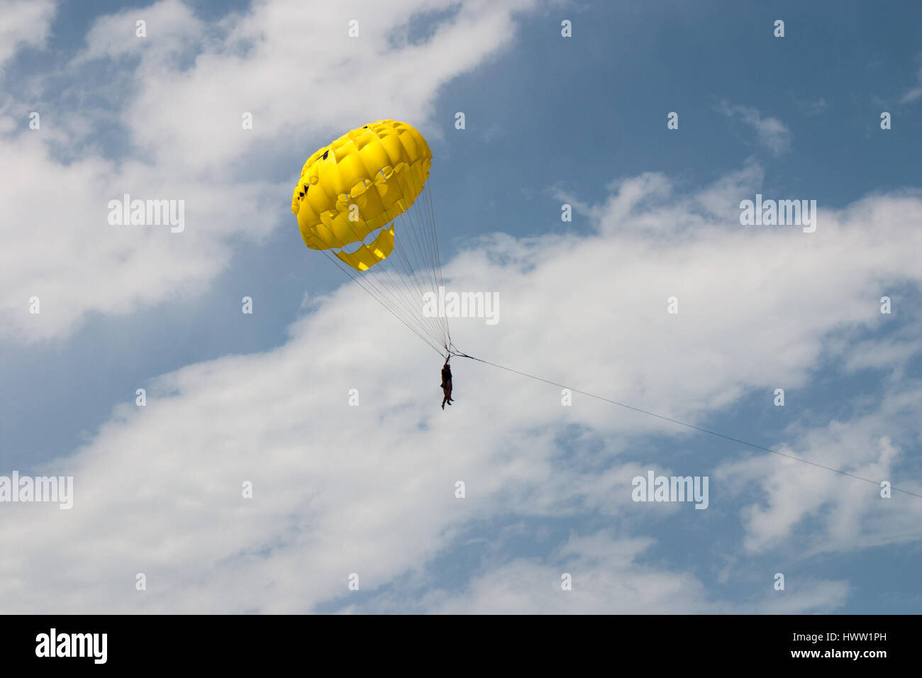 Parasailing on parachute over water hi-res stock photography and images ...