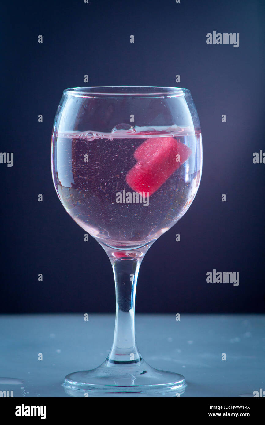 Clean drinking water from a source pouring into a clear glass beaker in ...