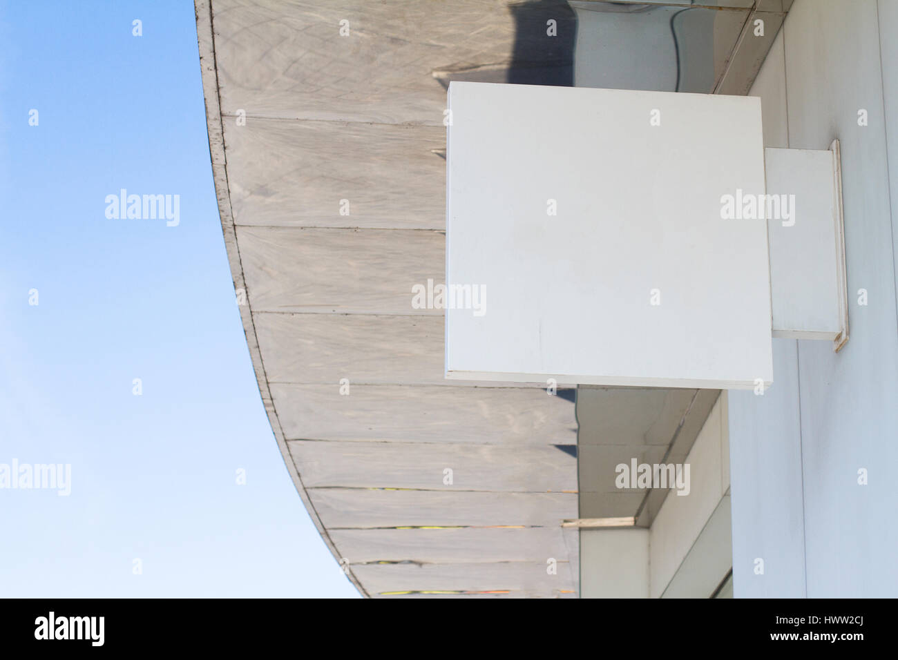 horizontal side view of empty white square signage on the exterior of a ...