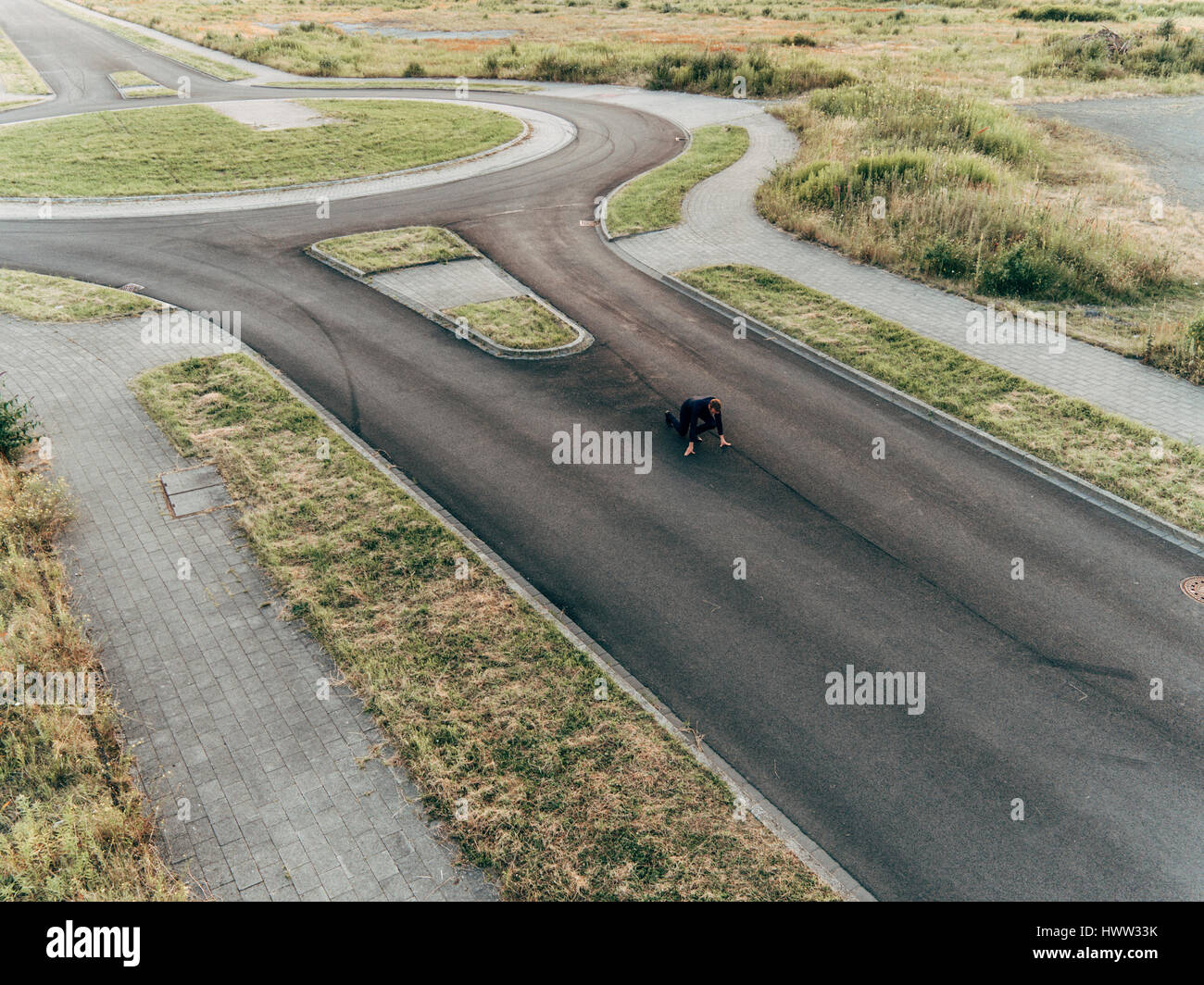 Businessman starting race at roundabout Stock Photo - Alamy