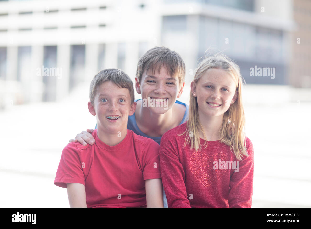 Best friends sitting together in the street Stock Photo - Alamy