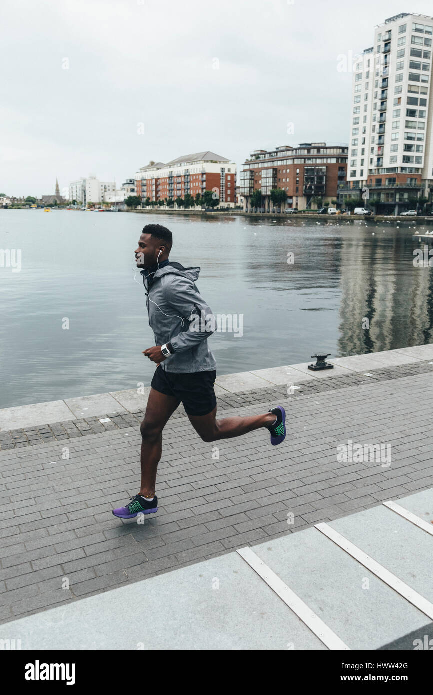 Young Man Running At Waterfront High Resolution Stock Photography and ...