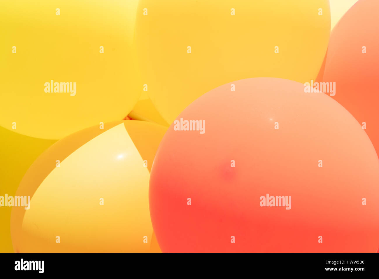Multi colour balloons in a bunch floating in the sky Stock Photo - Alamy