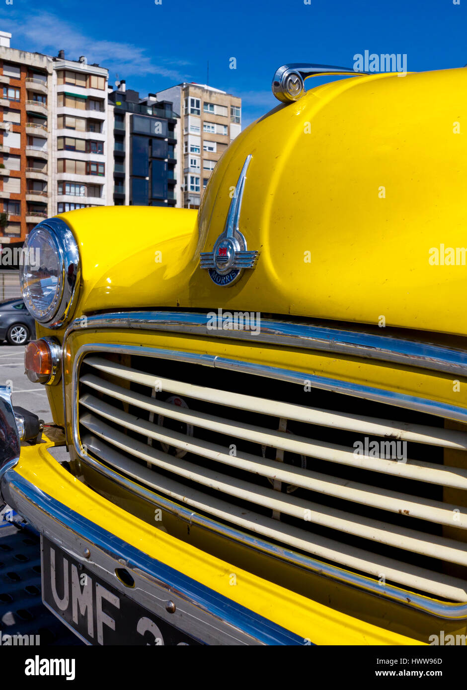 Radiator grille of bright yellow Moris Minor car Stock Photo - Alamy