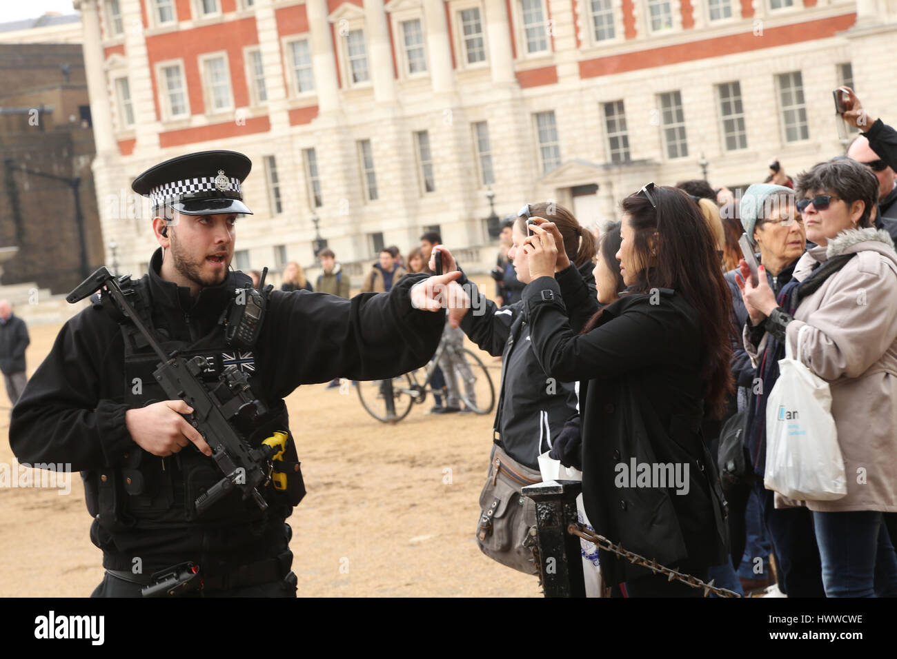 London, UK. 23rd March 2017. Armed Police watch over mounted soldiers ...
