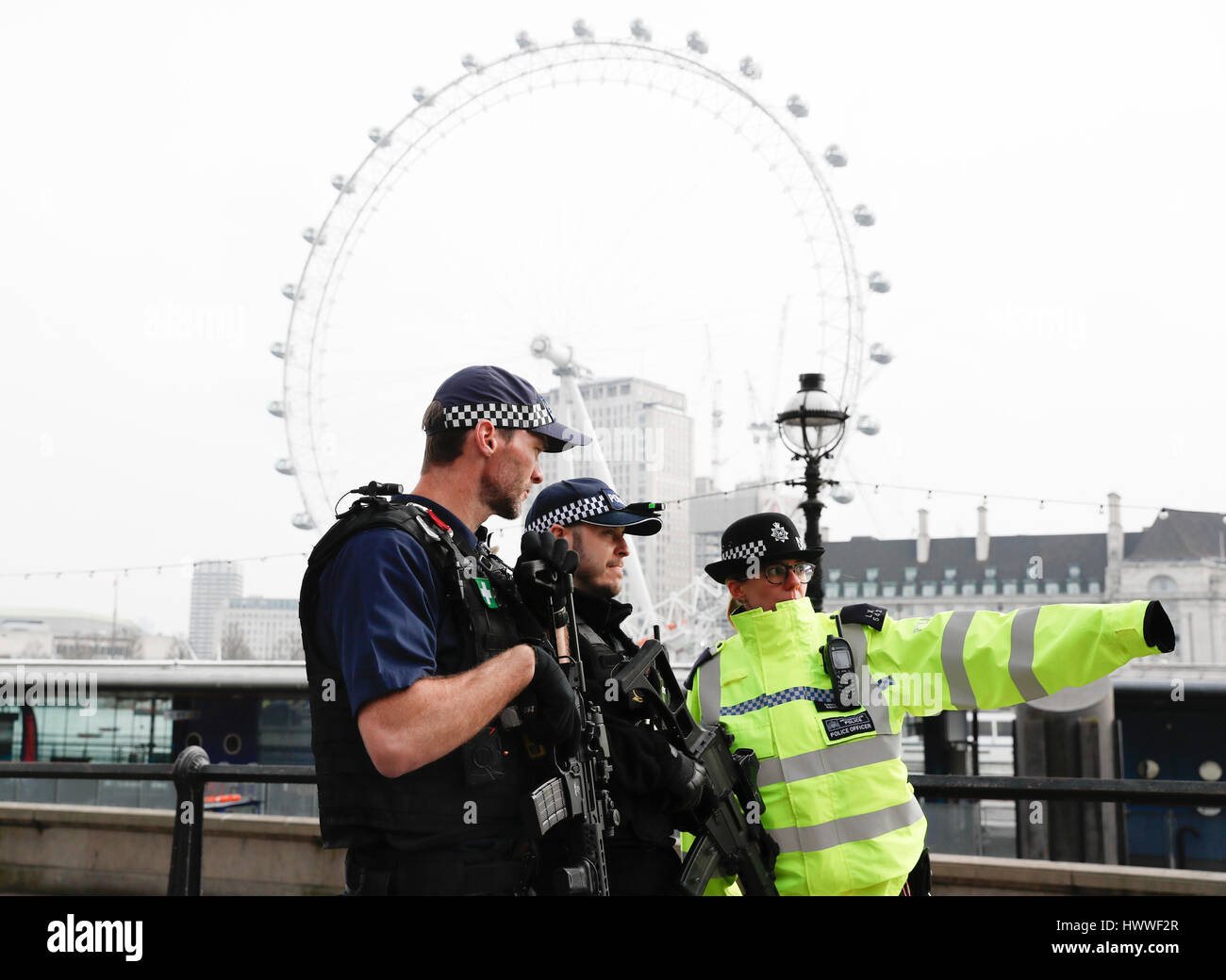 London, UK. 23rd Mar, 2017. Policemen stand guard near the Houses of ...