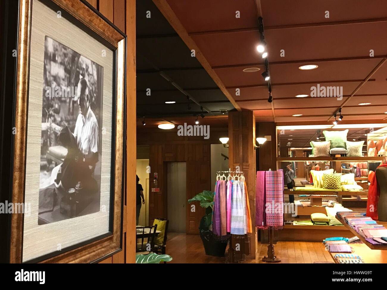 A portrait of American entrepreneur Jim Thompson (L) can be seen at a ...