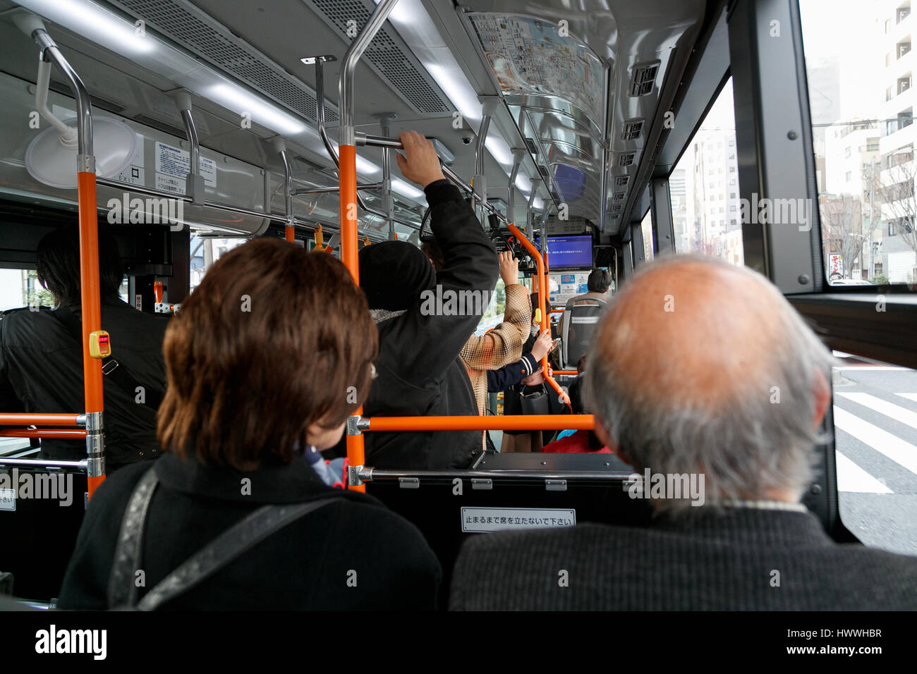 Passengers inside a hydrogen fuel cell bus on March 23, 2017, Tokyo ...