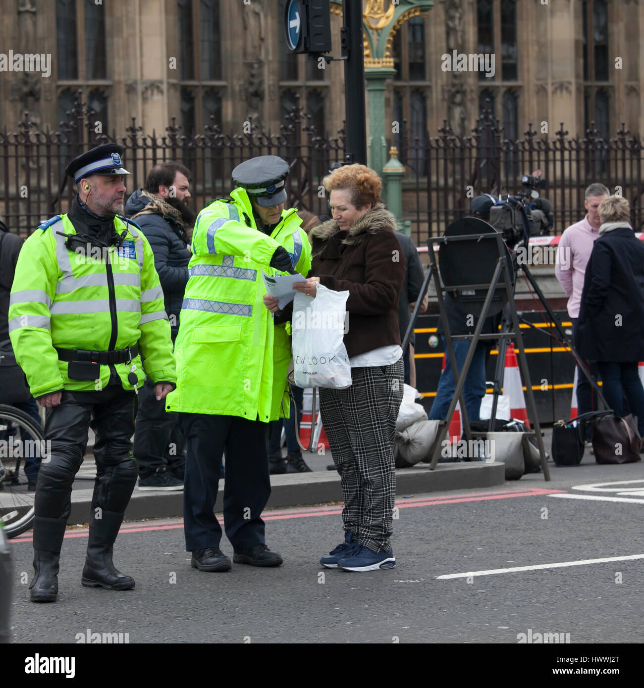London, UK Thursday March 23, 2017 Police officers stand guard on a ...