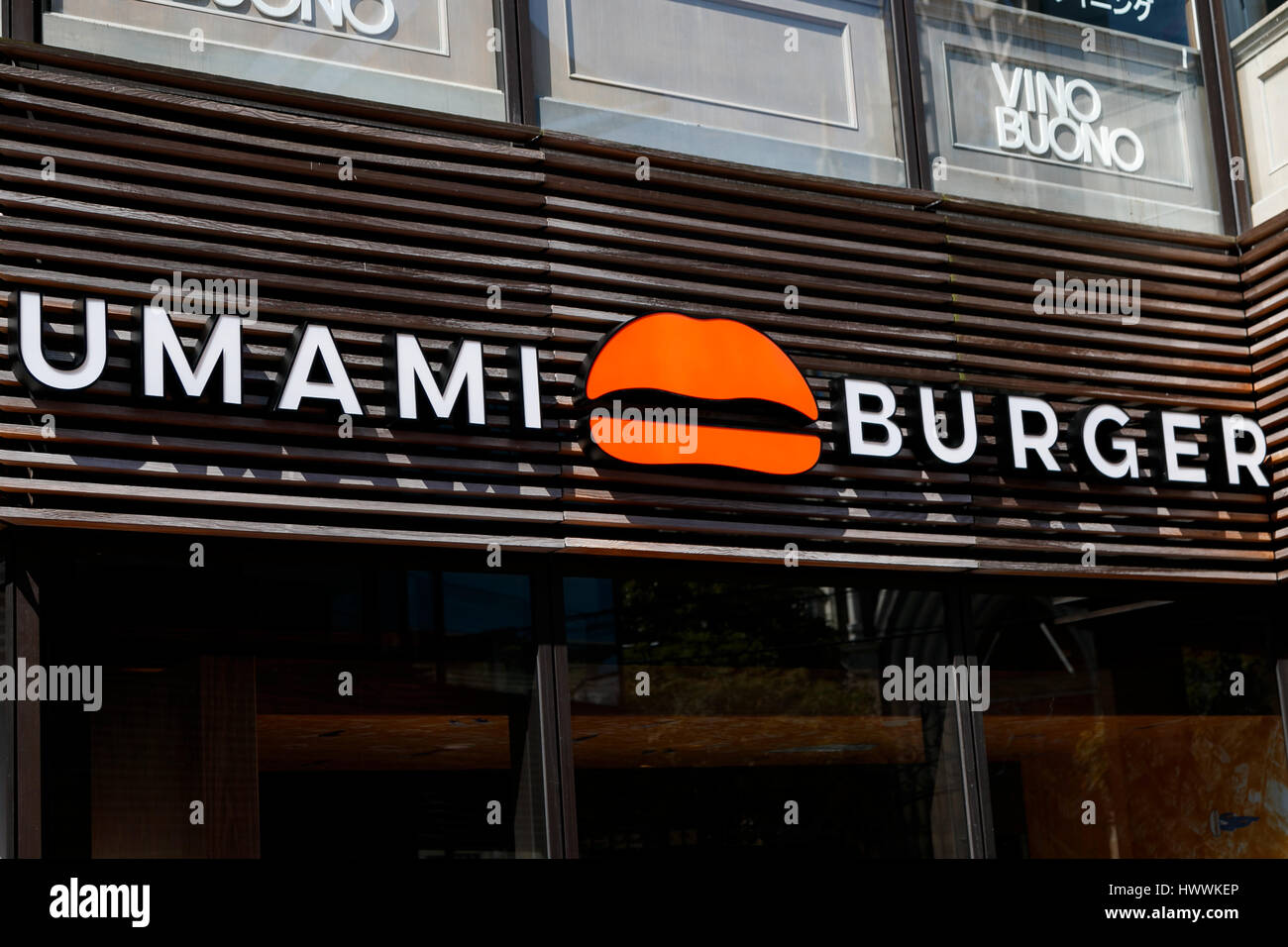 Umami Burger signboard on display outside its new restaurant in Aoyama ...
