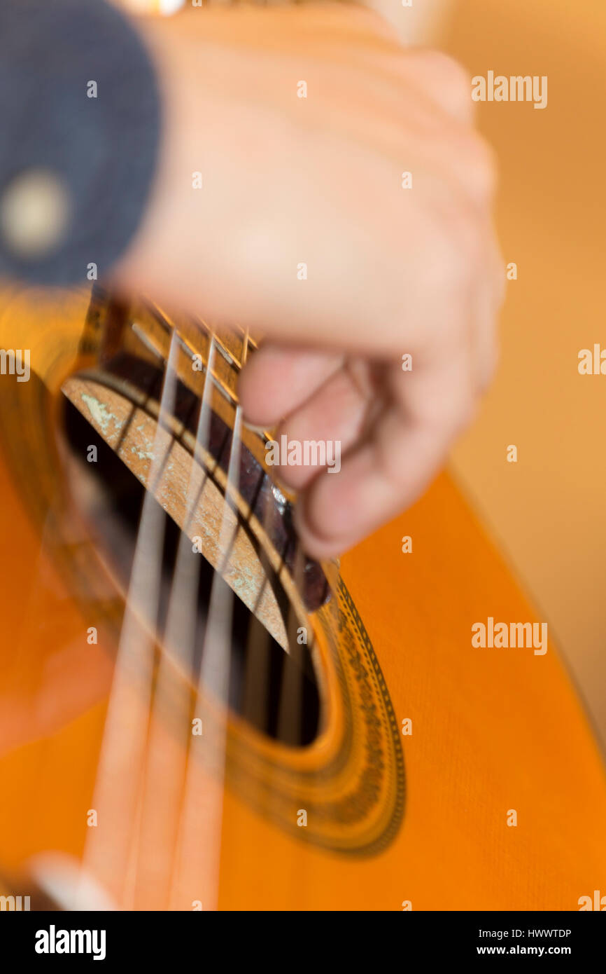 Classical guitar being played by young man Stock Photo - Alamy