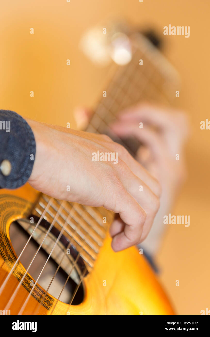 Classical guitar being played by young man Stock Photo - Alamy