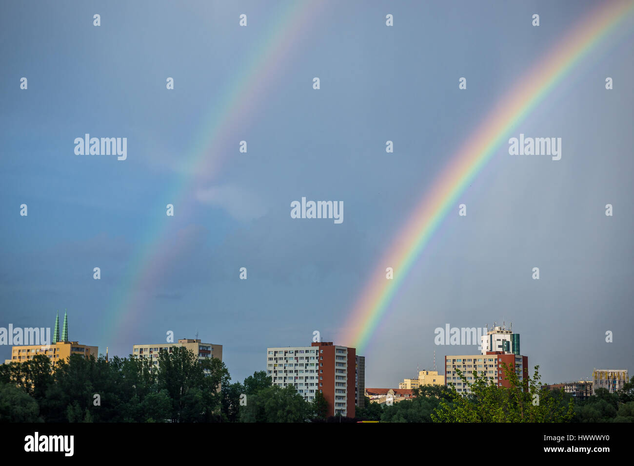 Rainbow over Warsaw city in Poland Stock Photo - Alamy