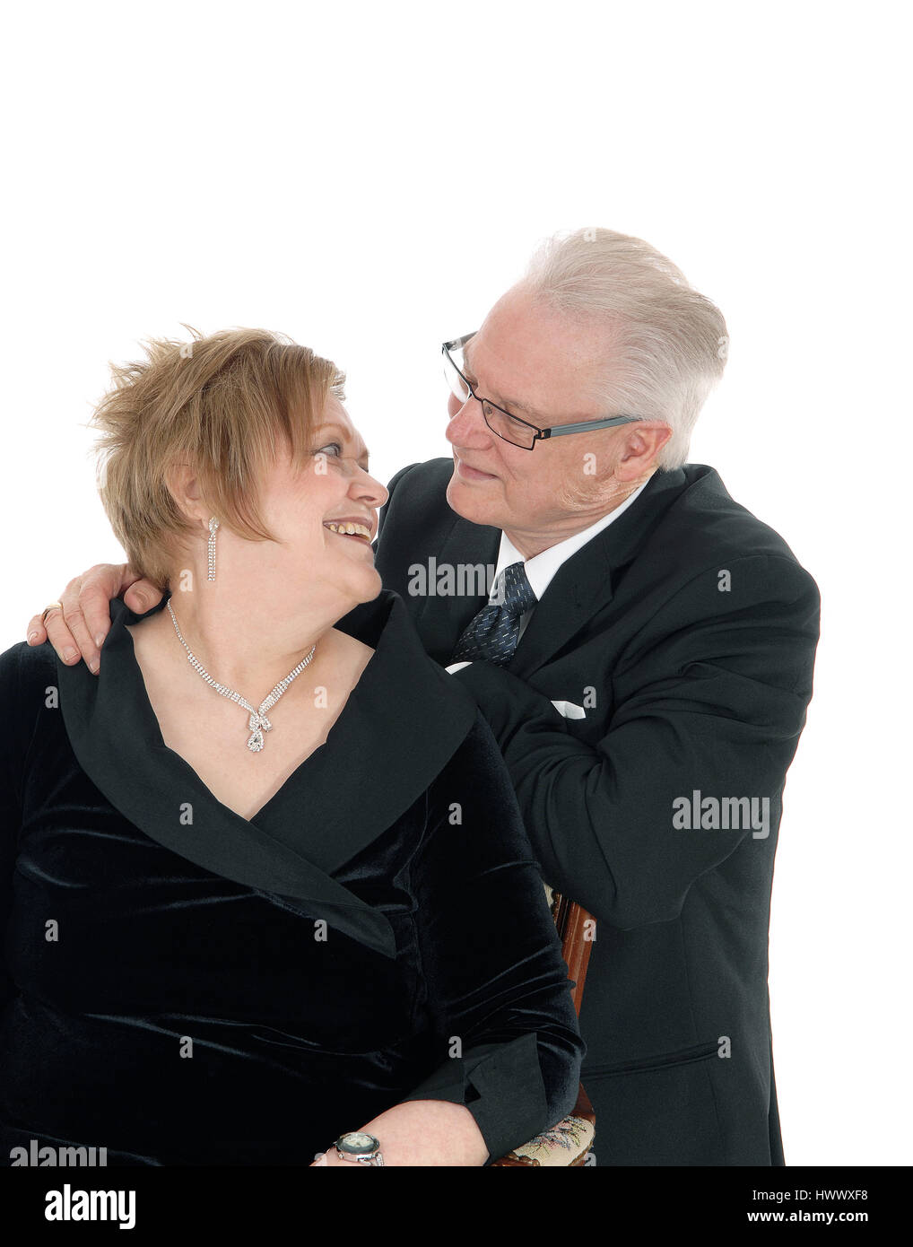 A very happy senior citizen couple looking smiling at each other in ...