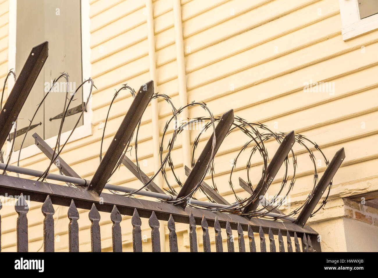Coils of Razor Wire by House Stock Photo - Alamy