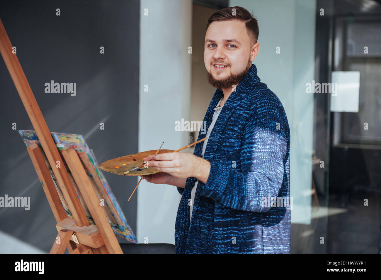 artist painting a picture in a studio Stock Photo - Alamy