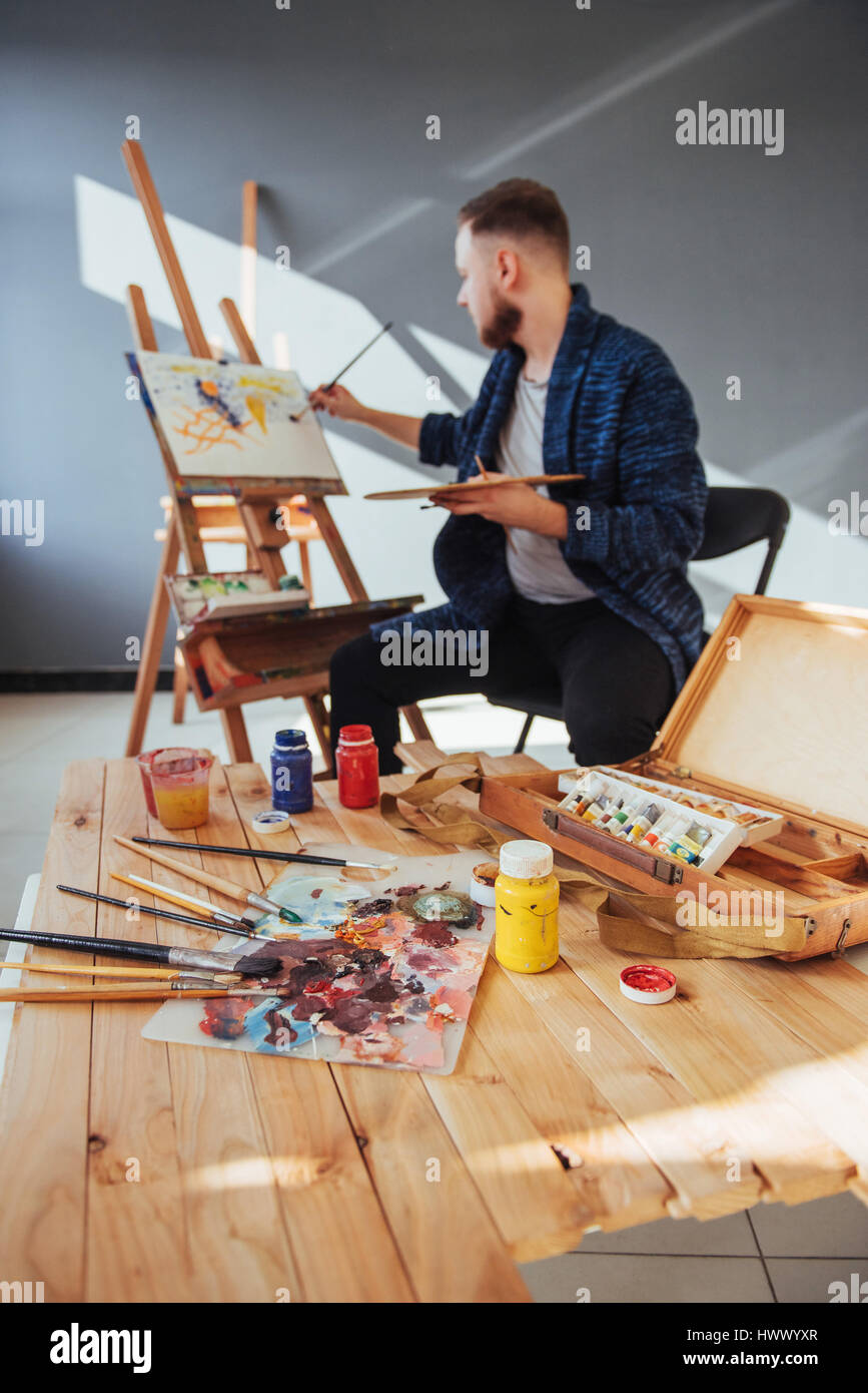 artist painting a picture in a studio Stock Photo - Alamy