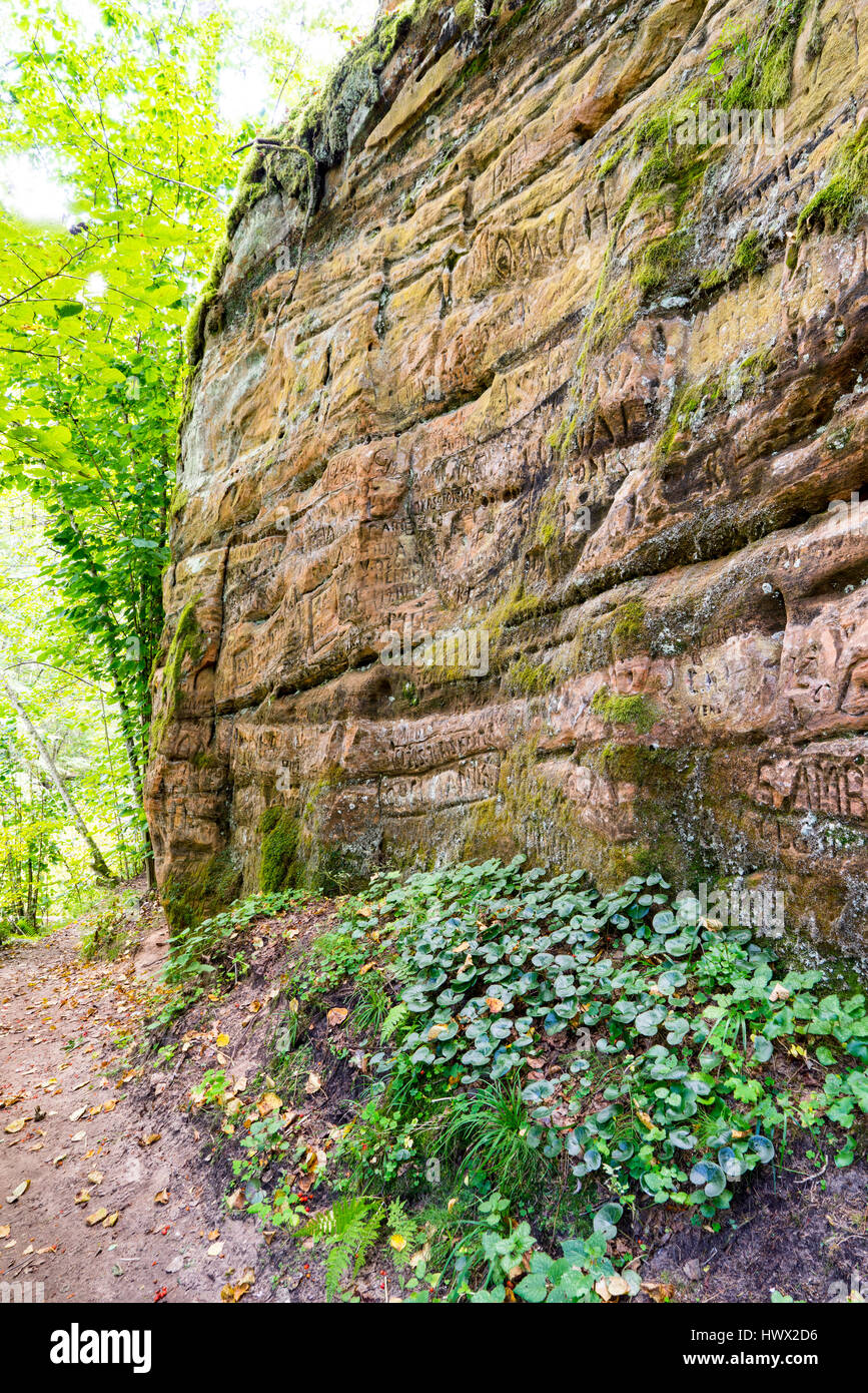 sandstone cliffs with inscriptions near tourist trails Stock Photo - Alamy